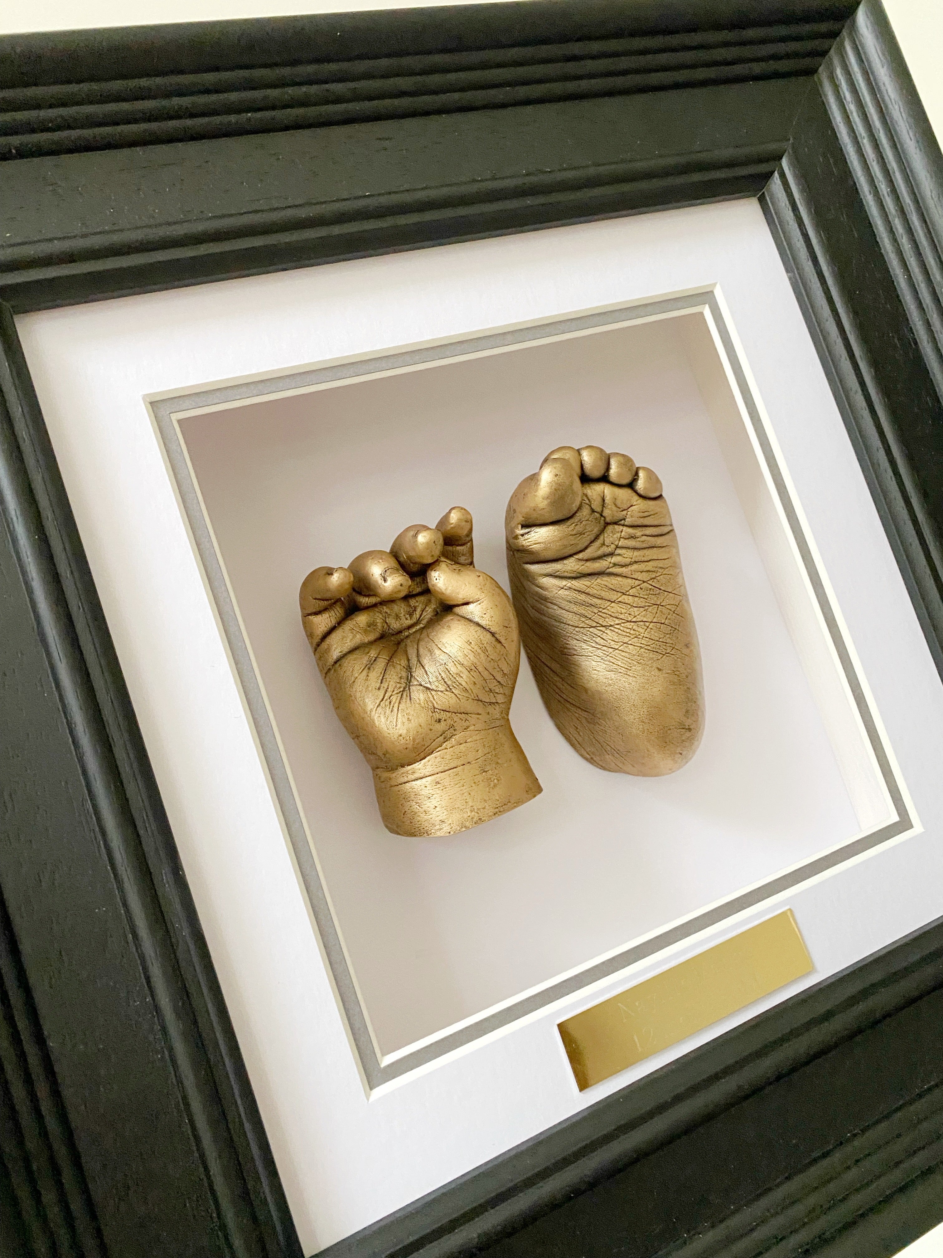Black Premium Bevelled Frame ft. brass-finished casts with grey underm ...